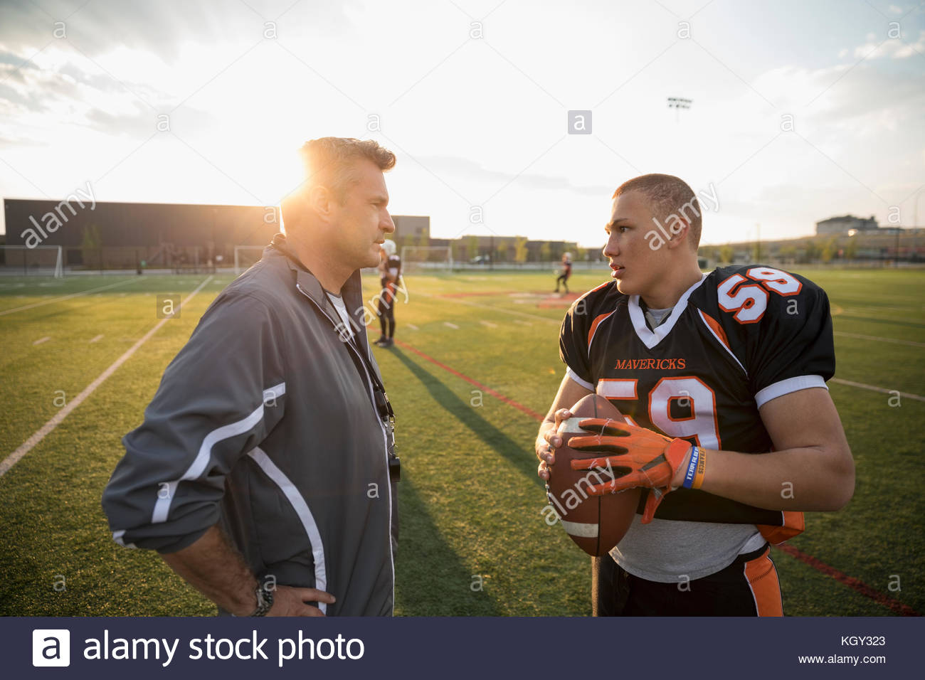 Group talking serious hi-res stock photography and images - Alamy