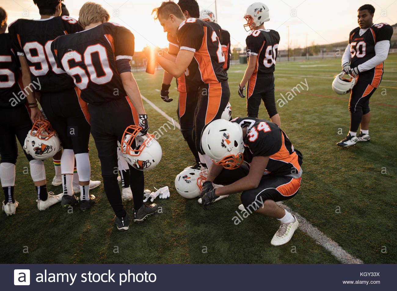 Football player holding helmet football hi-res stock photography and ...