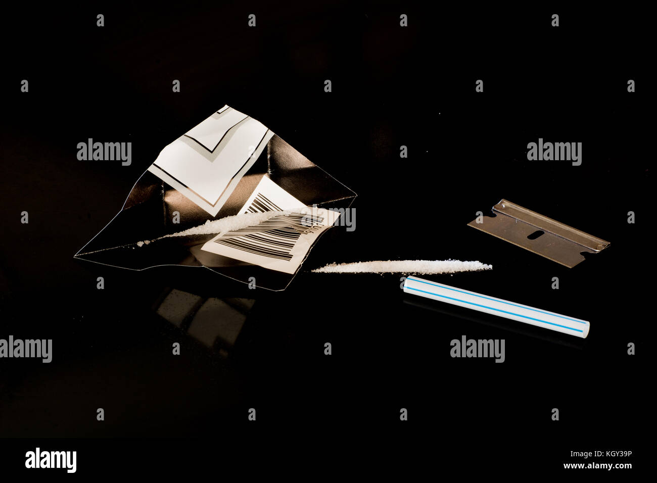 Cocaine drug items on a black background Stock Photo - Alamy