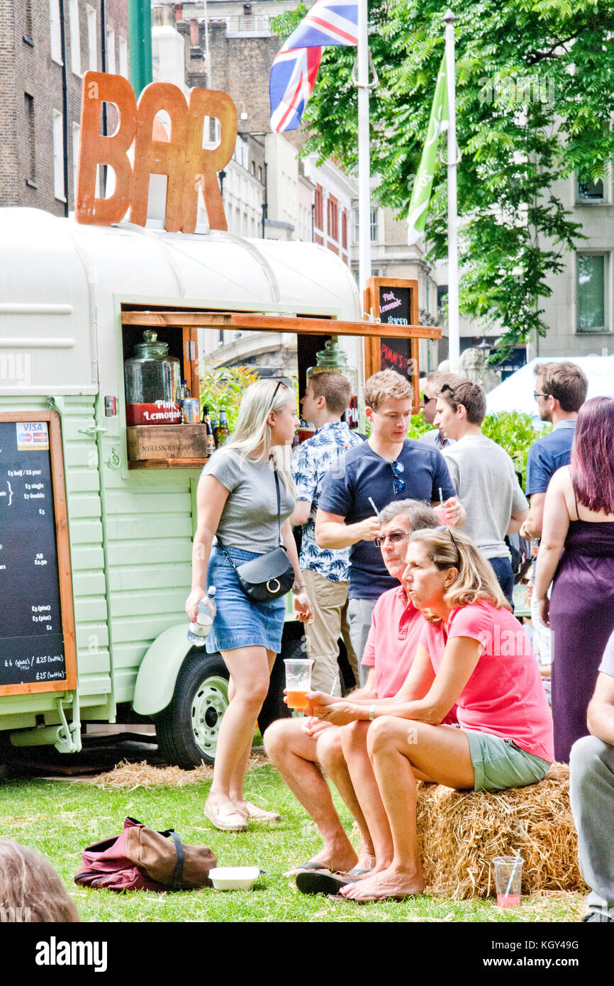 People queuing up for beer to the bar in Central London, Uk, in the ...
