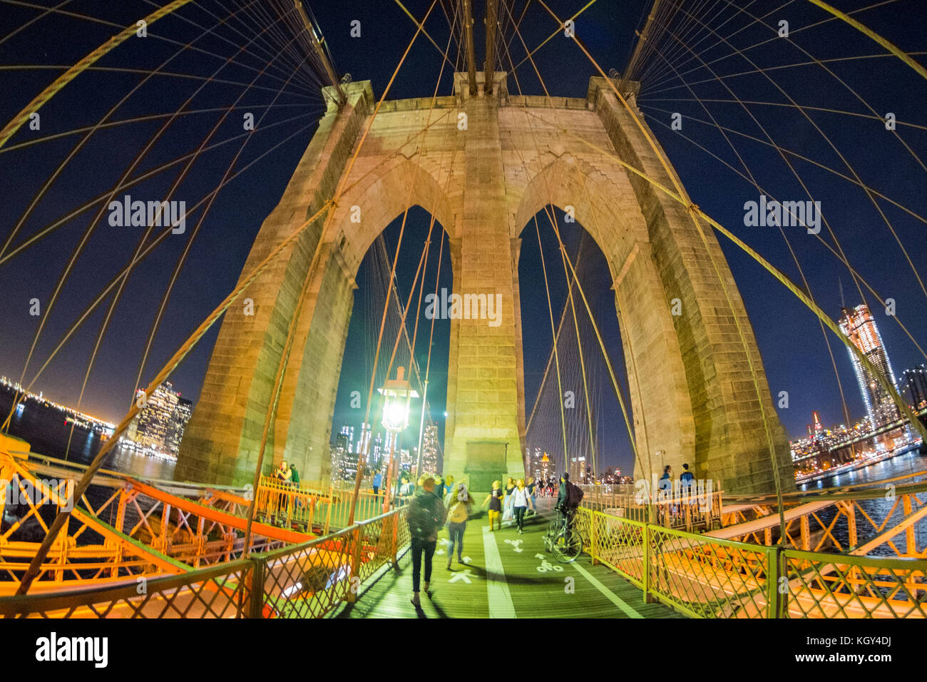 Brooklyn bridge at night photographed from the pedestrian walkway with ...