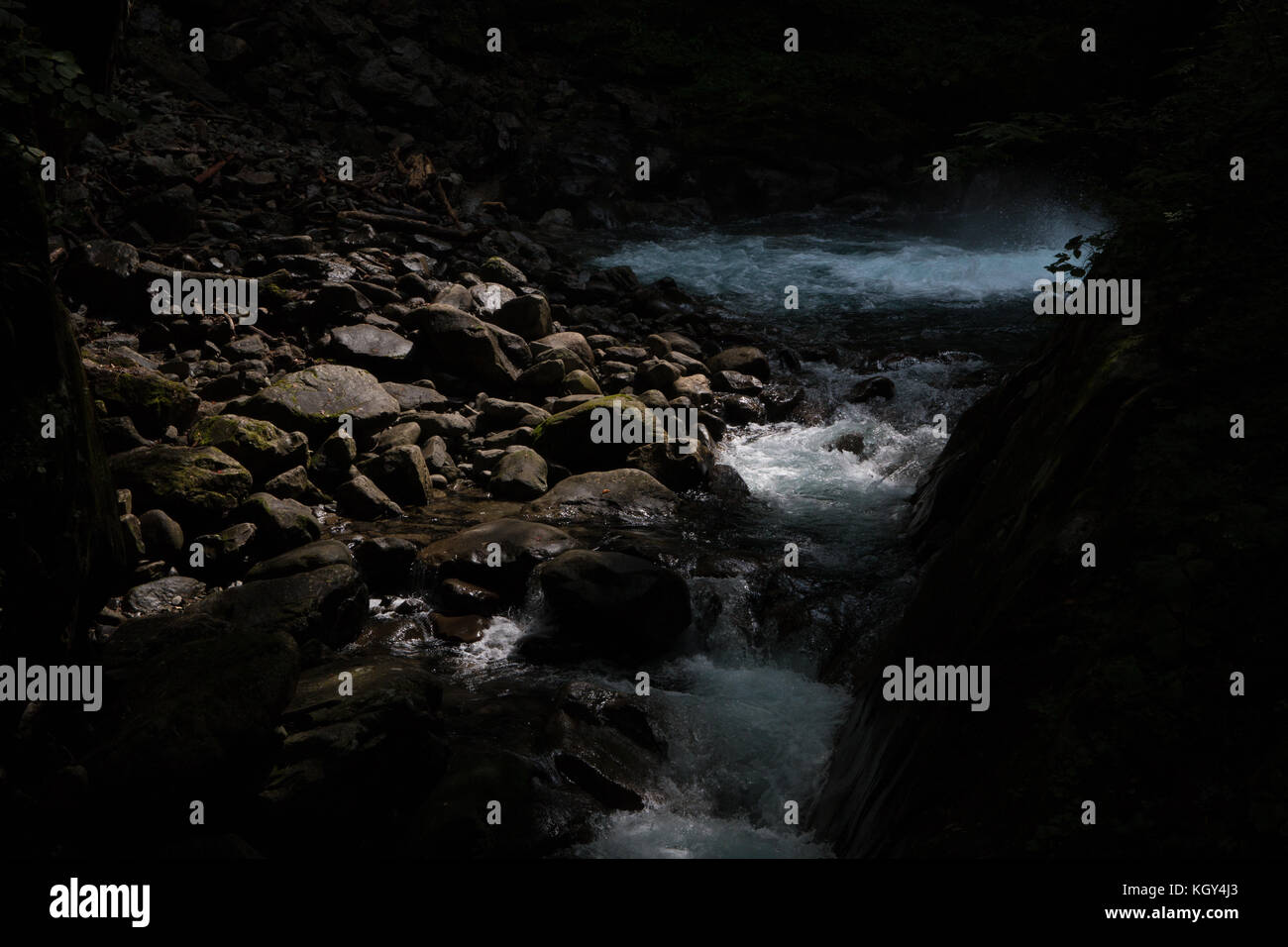 Mountain stream in the shade Stock Photo - Alamy