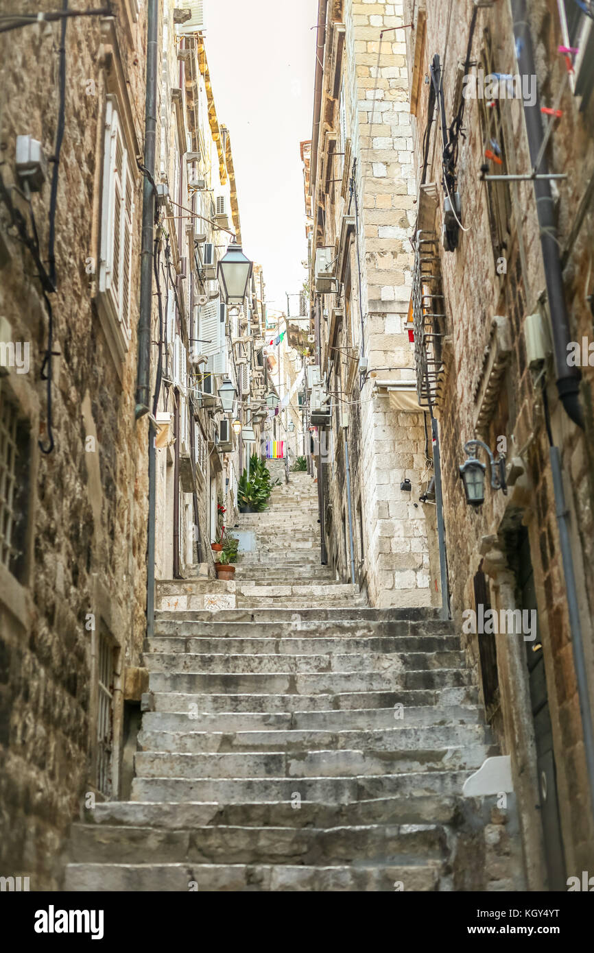A view of a street full of steps in the old city core in Dubrovnik ...