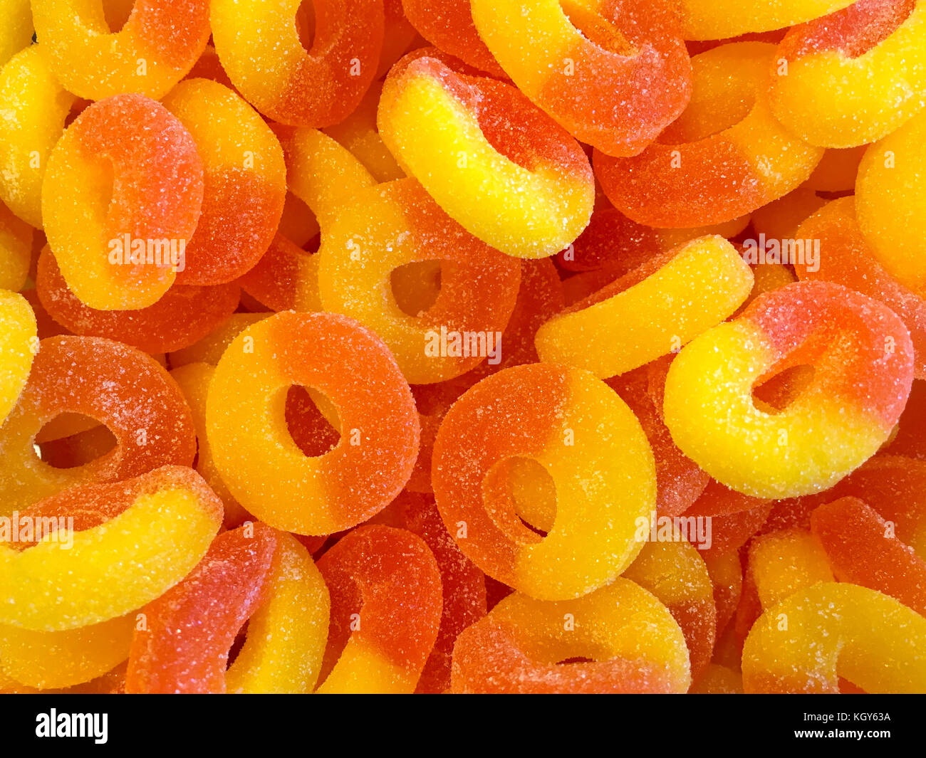 bright orange and yellow sugar coated fruit rings Stock Photo - Alamy