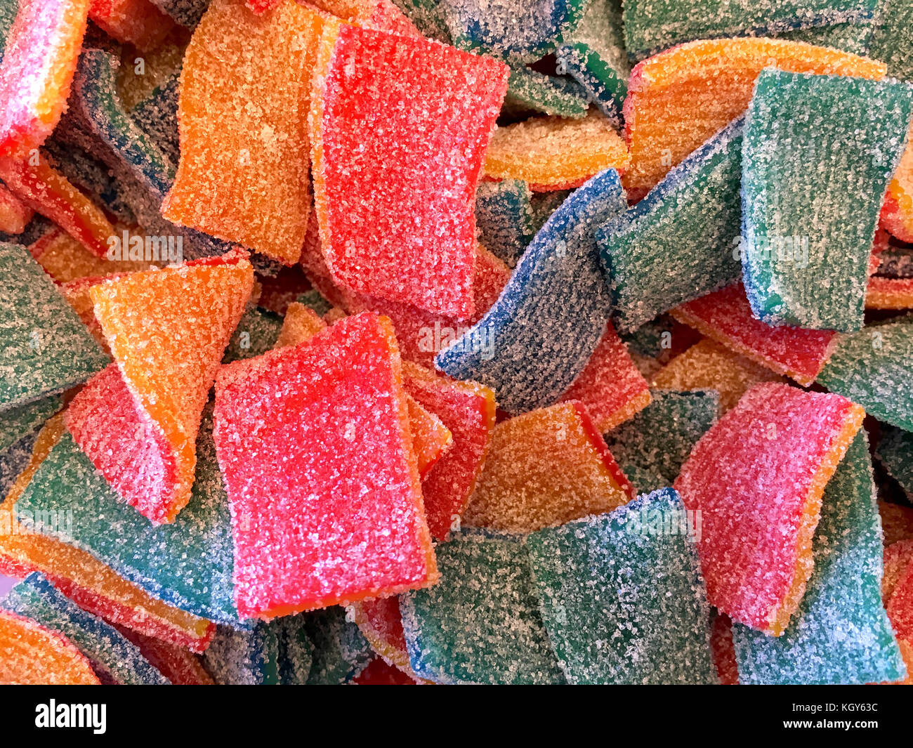 bright sugar coated fruit snack squares covered in granulated sugar ...