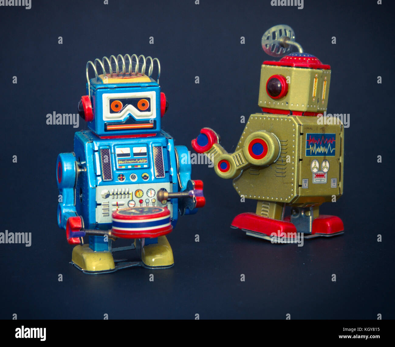 two retro robot toys on black Stock Photo - Alamy