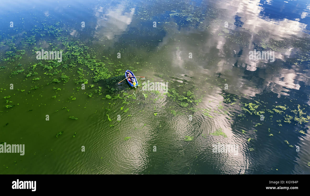 Aerial view of a wooden boat in the lake Stock Photo - Alamy