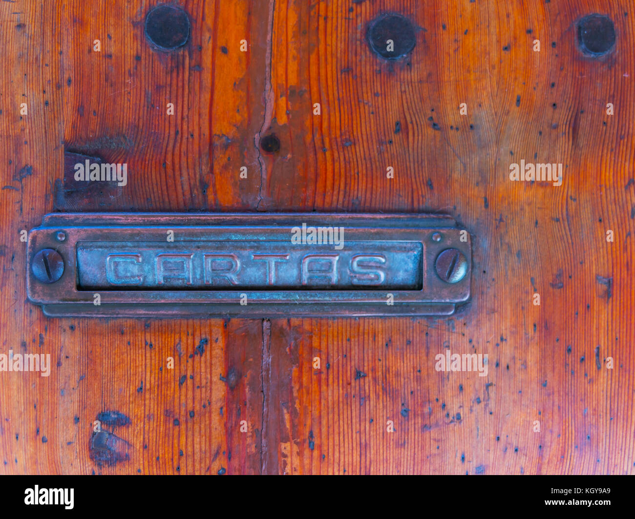 Old letterbox in the door, traditional way of delivering letters to the ...