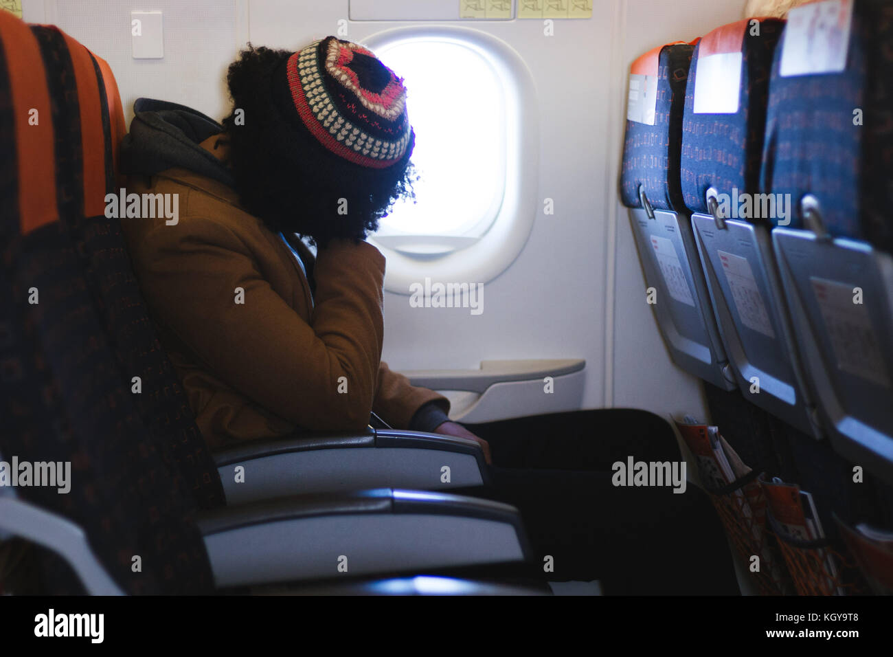 tired guy falling to sleep on a plane journey Stock Photo - Alamy