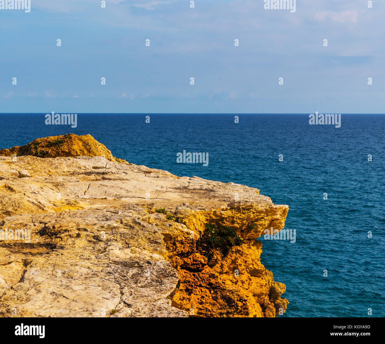 high cliff above the sea, summer sea background, many splashing waves ...