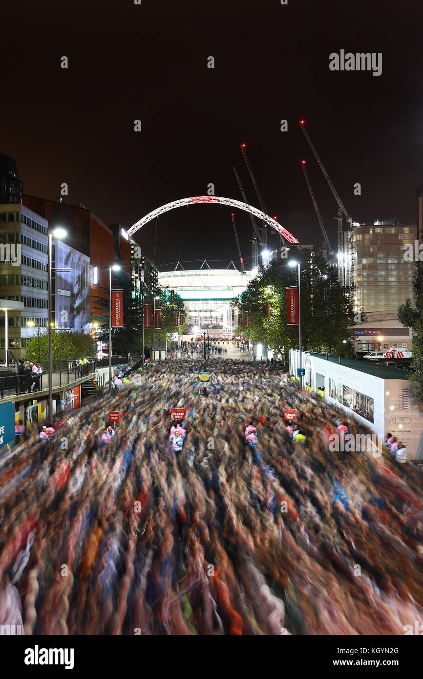Football fans are blurred as they leave Wembley Stadium after the ...