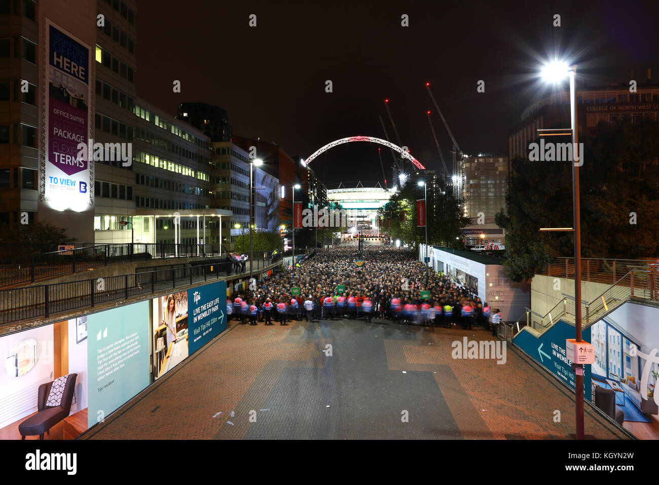 Football fans are held back by crowd control stewards as they leave ...