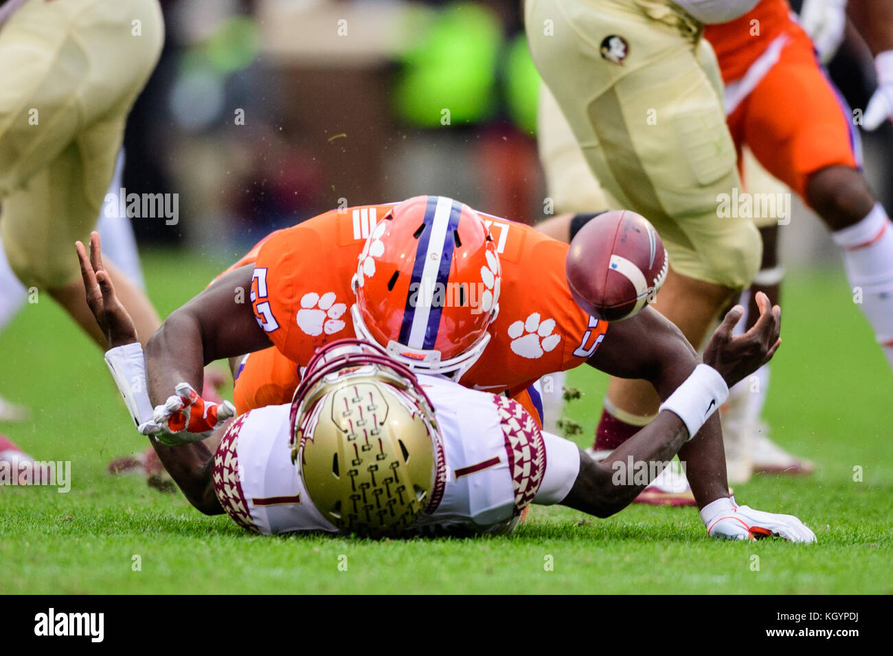 Clemson linebacker Tre Lamar (57) forces a fumble from Florida State ...