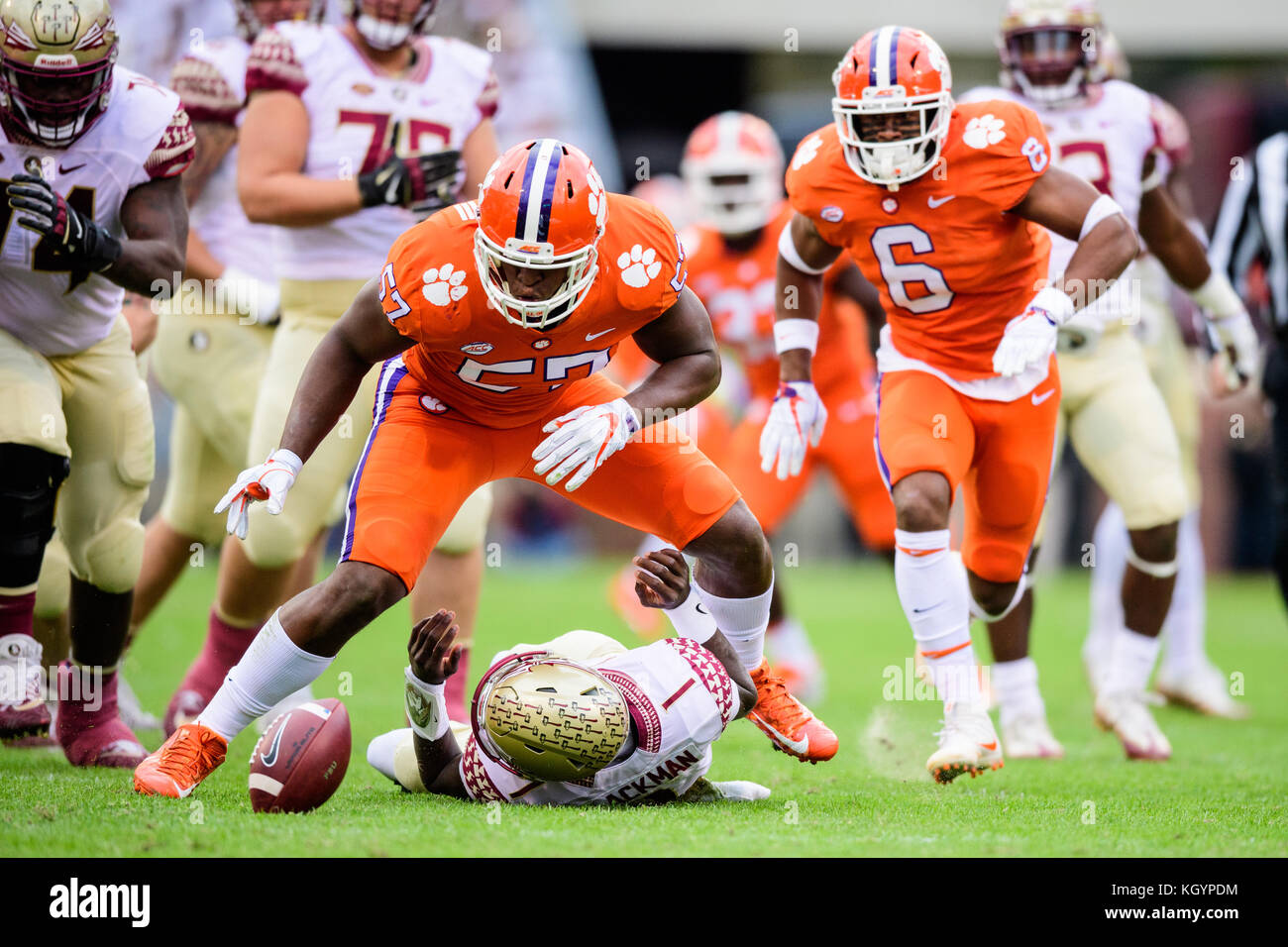 Clemson linebacker Tre Lamar (57) forces a fumble from Florida State ...