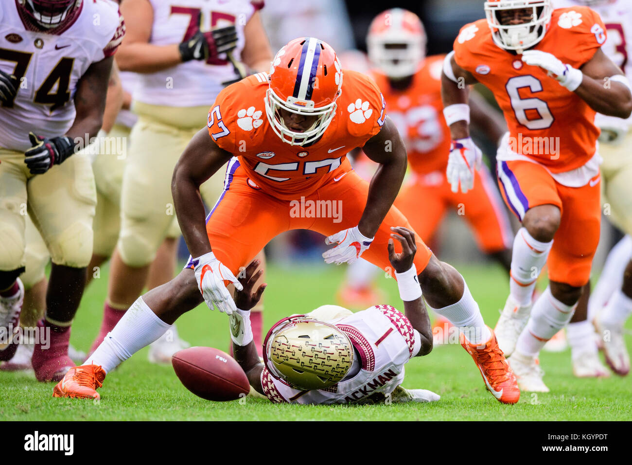 Clemson linebacker Tre Lamar (57) forces a fumble from Florida State ...