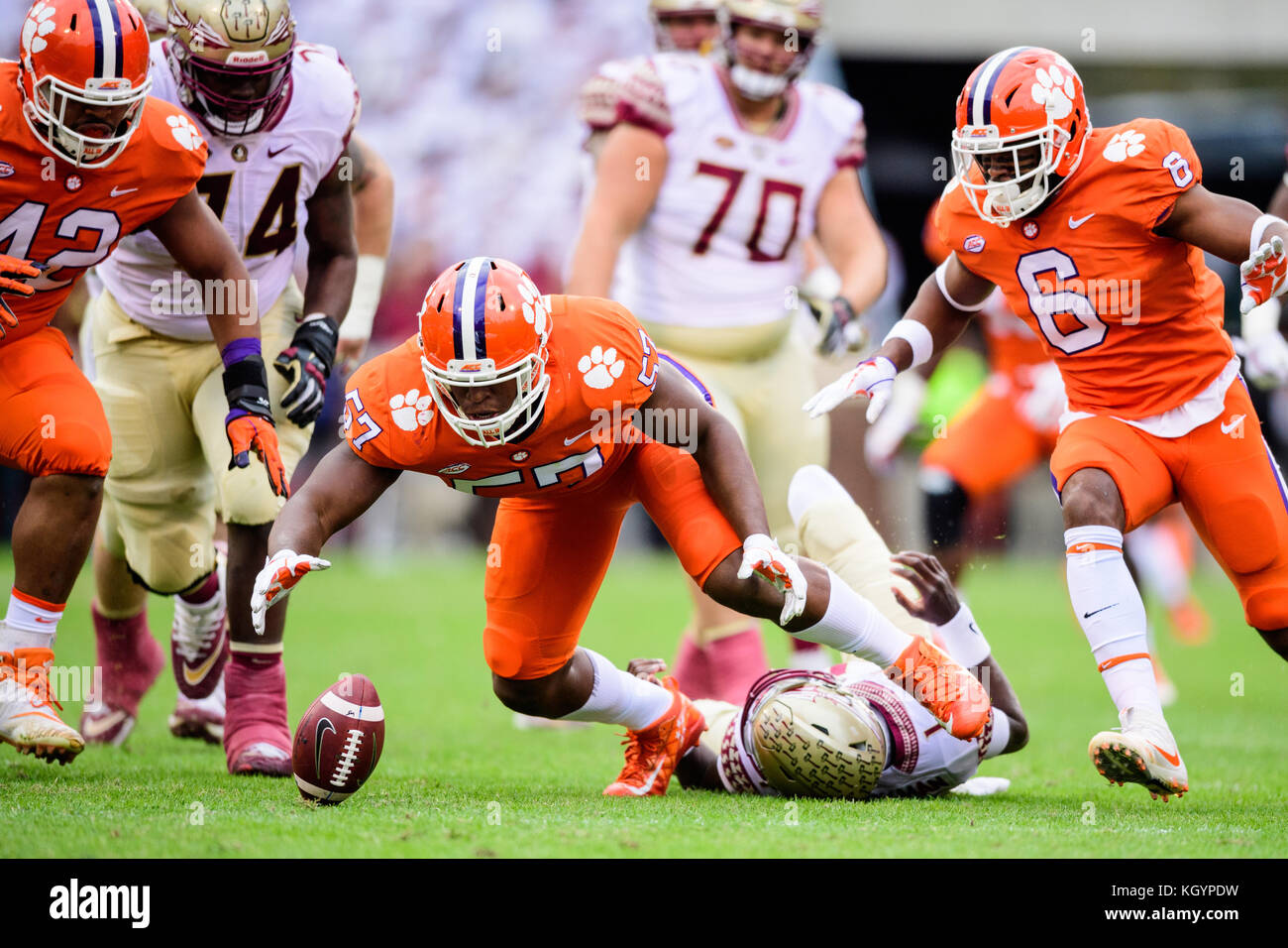 Clemson linebacker Tre Lamar (57) forces a fumble from Florida State ...