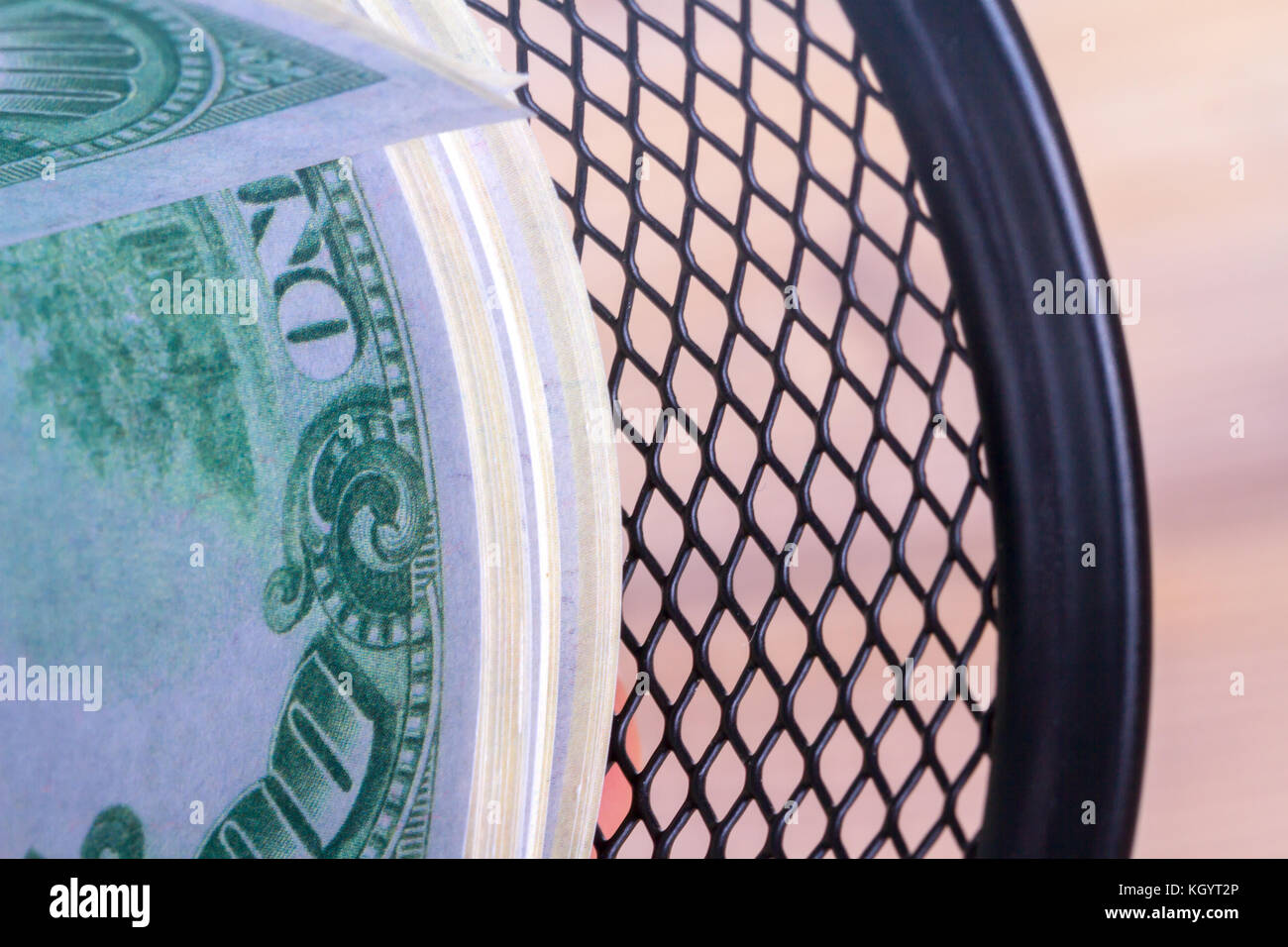 Bankroll cash euro banknotes in garbage basket focused on consuming in ...