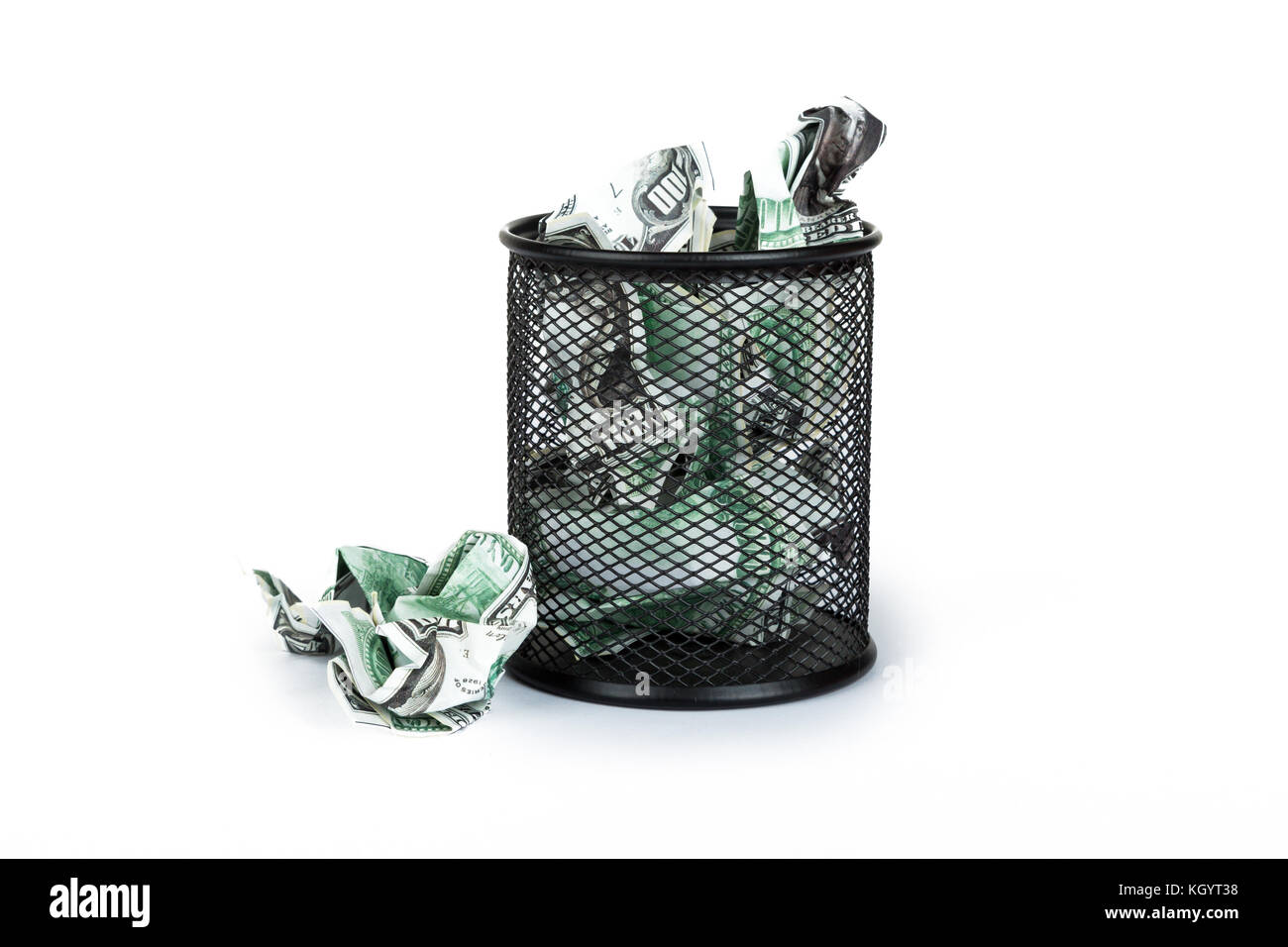 Dollar banknotes crumpled inside garbage basket, rubbish bin focused on ...