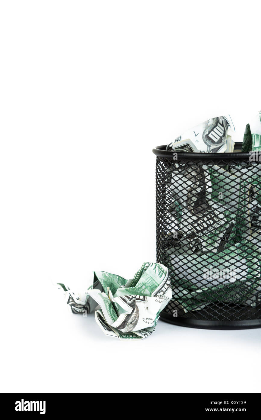 Dollar banknotes crumpled inside garbage basket, rubbish bin focused on ...