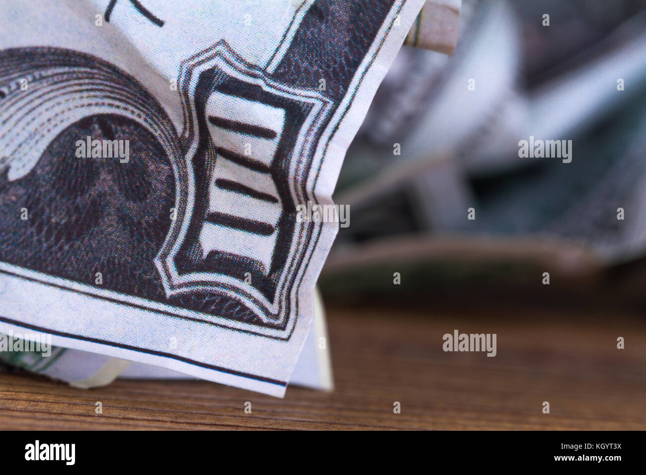 Dollar banknotes crumpled inside garbage basket, rubbish bin focused on ...