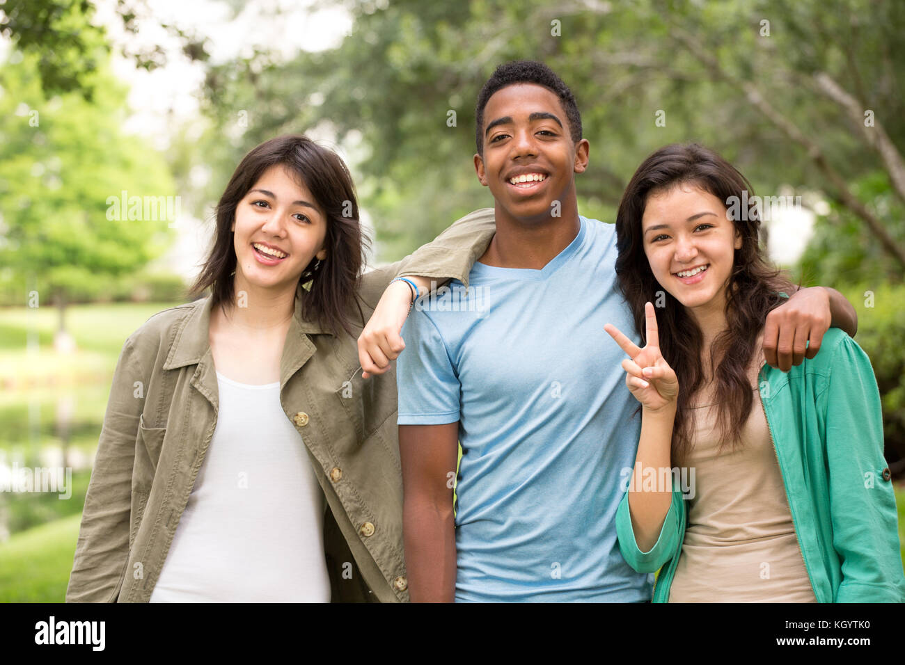 Diverse group of teenagers talking and laughing Stock Photo - Alamy