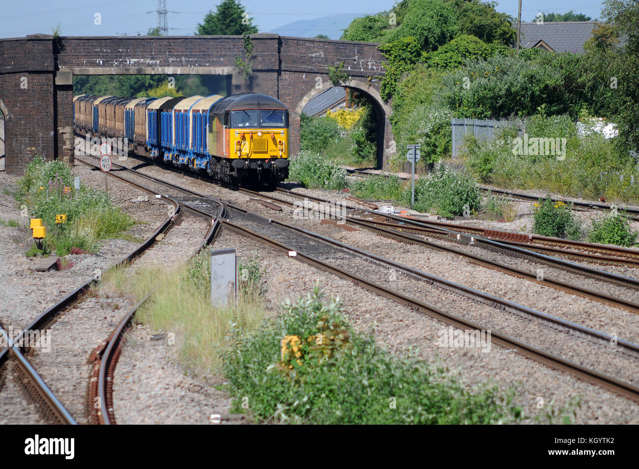 56302 heads a Chirk - Teigngrace train of empty log carriers through ...