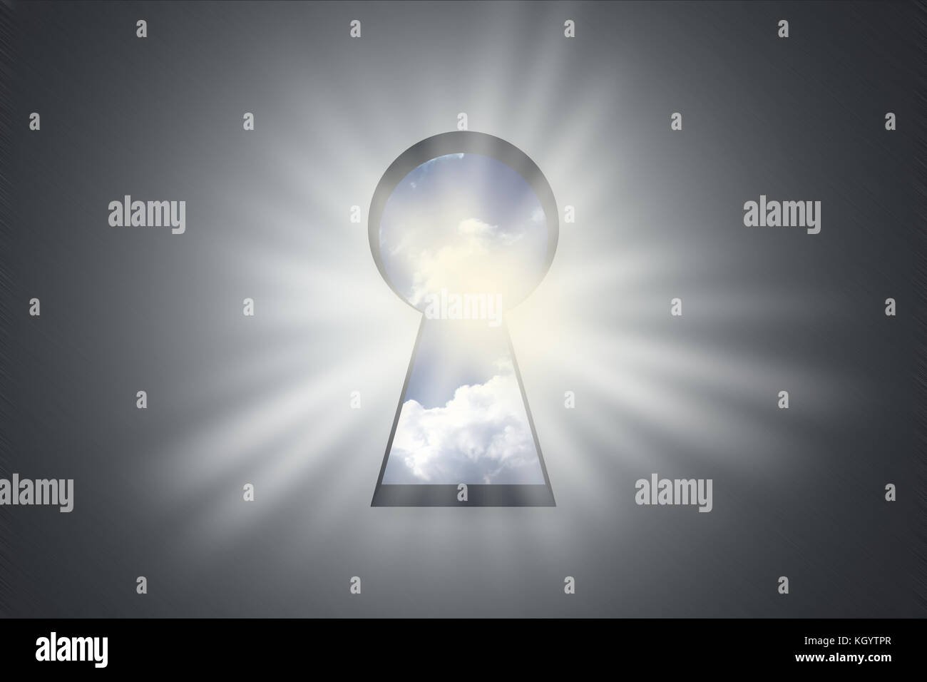 Cloudy shiny sky with light beam inside a key hole on dark grey ...