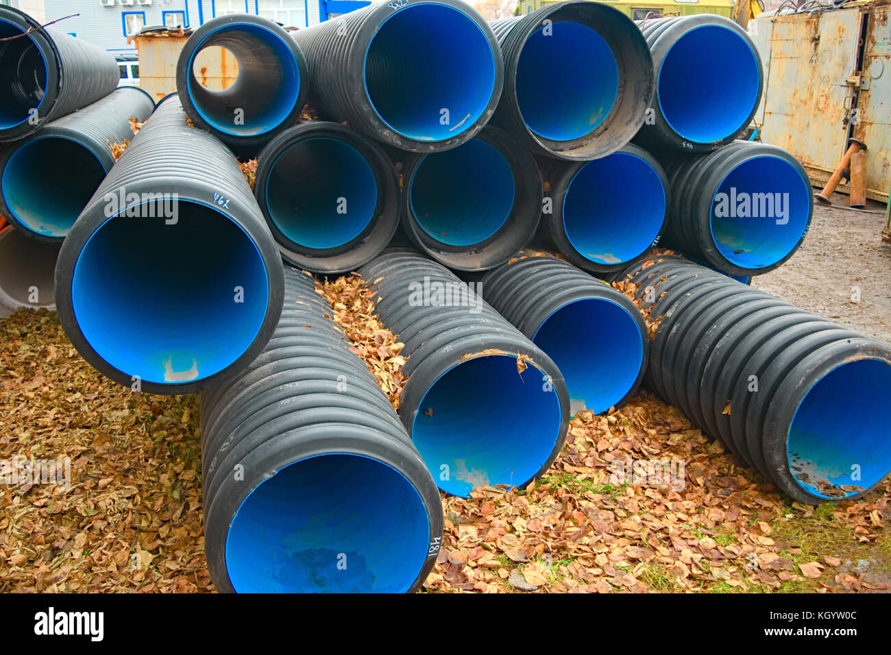 Pipes of PVC large diameter prepared for laying on construction site ...