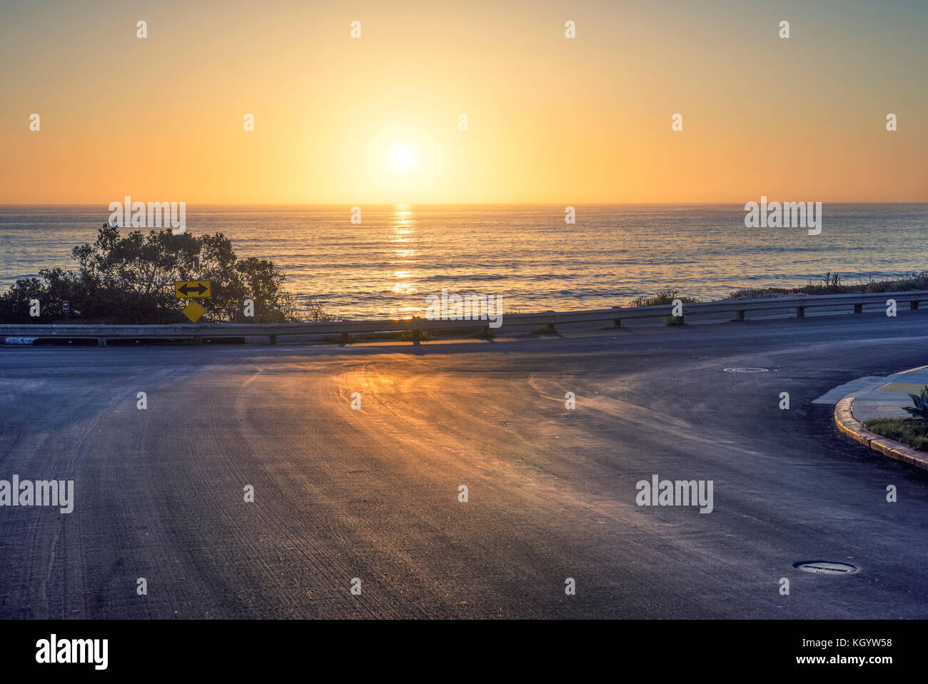 Street view of a coastal sunset at the intersection of Hill Street and ...