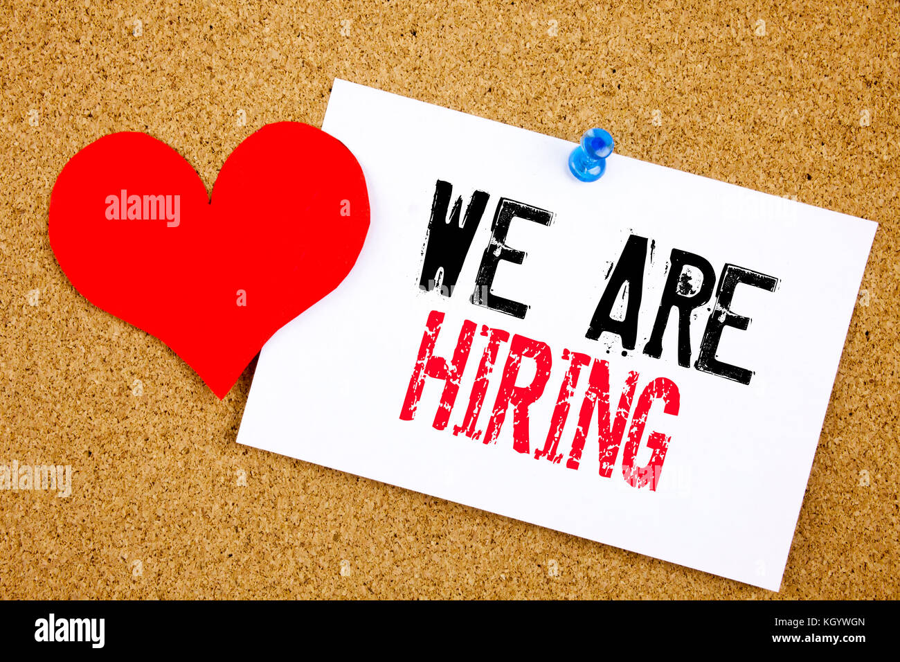 Now hiring Written on Sticky Note Message Stock Photo - Alamy