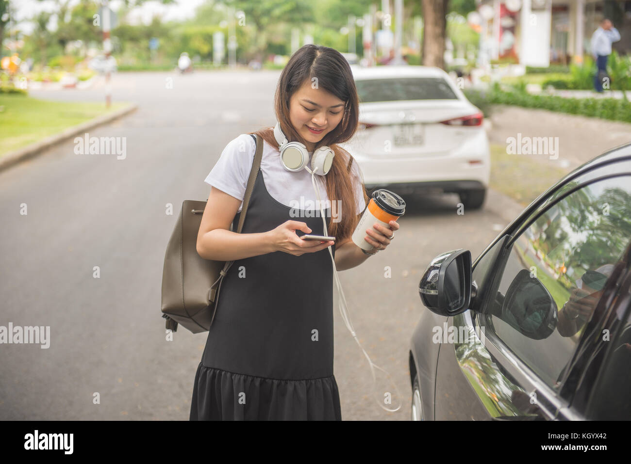Happy girl texting with friends on smart phone Stock Photo - Alamy