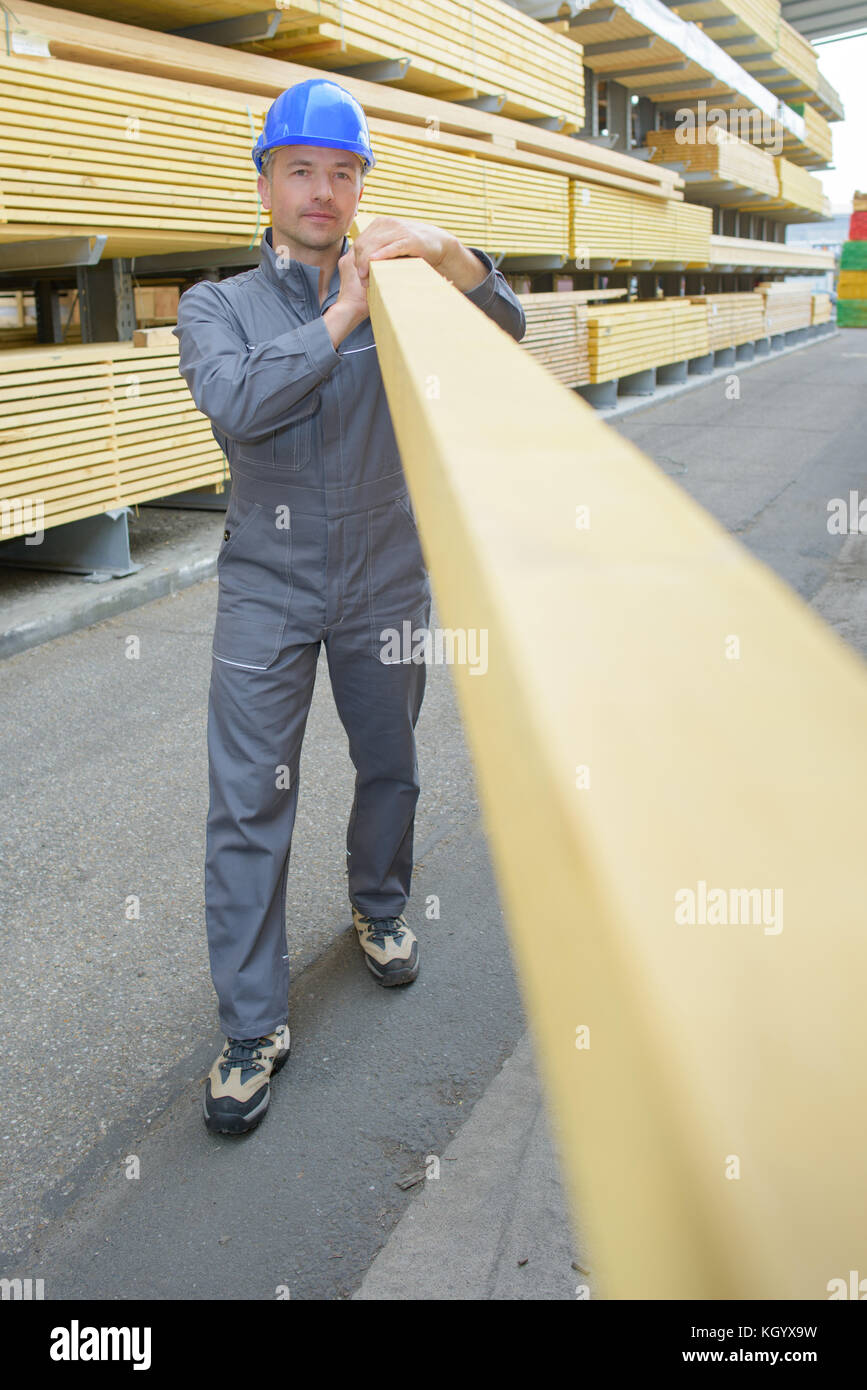 carrying a plank Stock Photo - Alamy