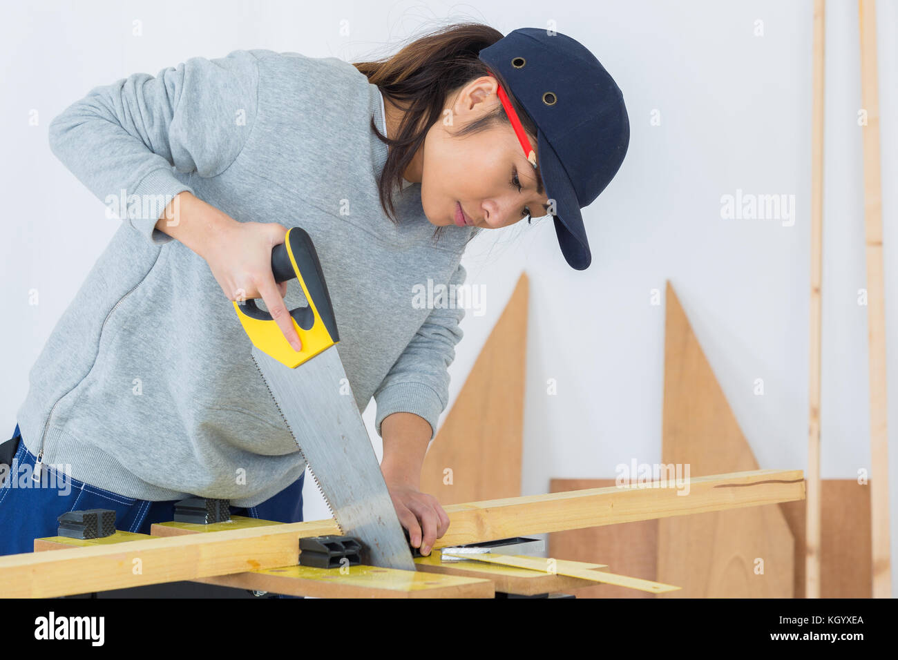 beautiful woman with a handsaw Stock Photo - Alamy
