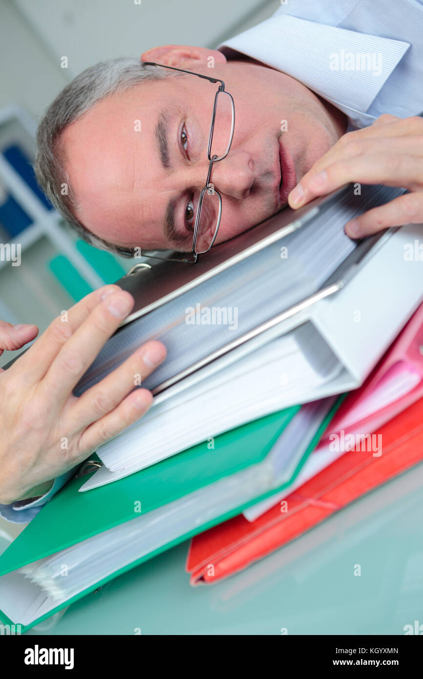 man sleeping at his desk stress and exhaustion concept Stock Photo - Alamy
