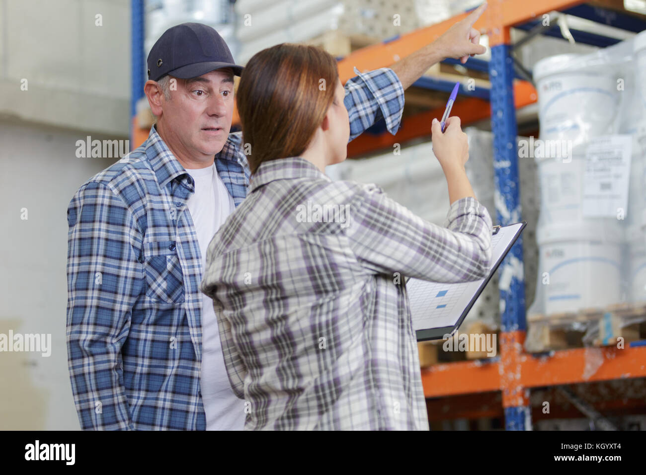 warehouse workers doing an inventory in a paint hardware store Stock ...