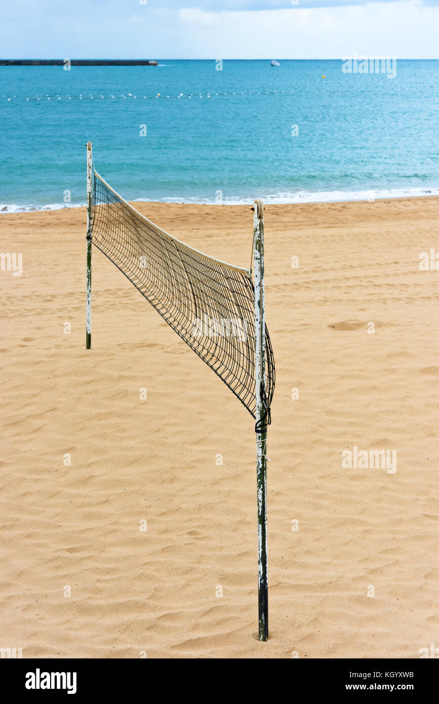 Volleyball net on a sand beach by the sea. Vertical shot Stock Photo ...