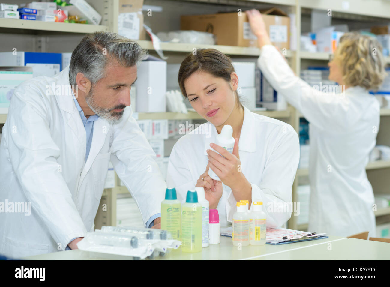 pharmacist inspecting the products Stock Photo - Alamy