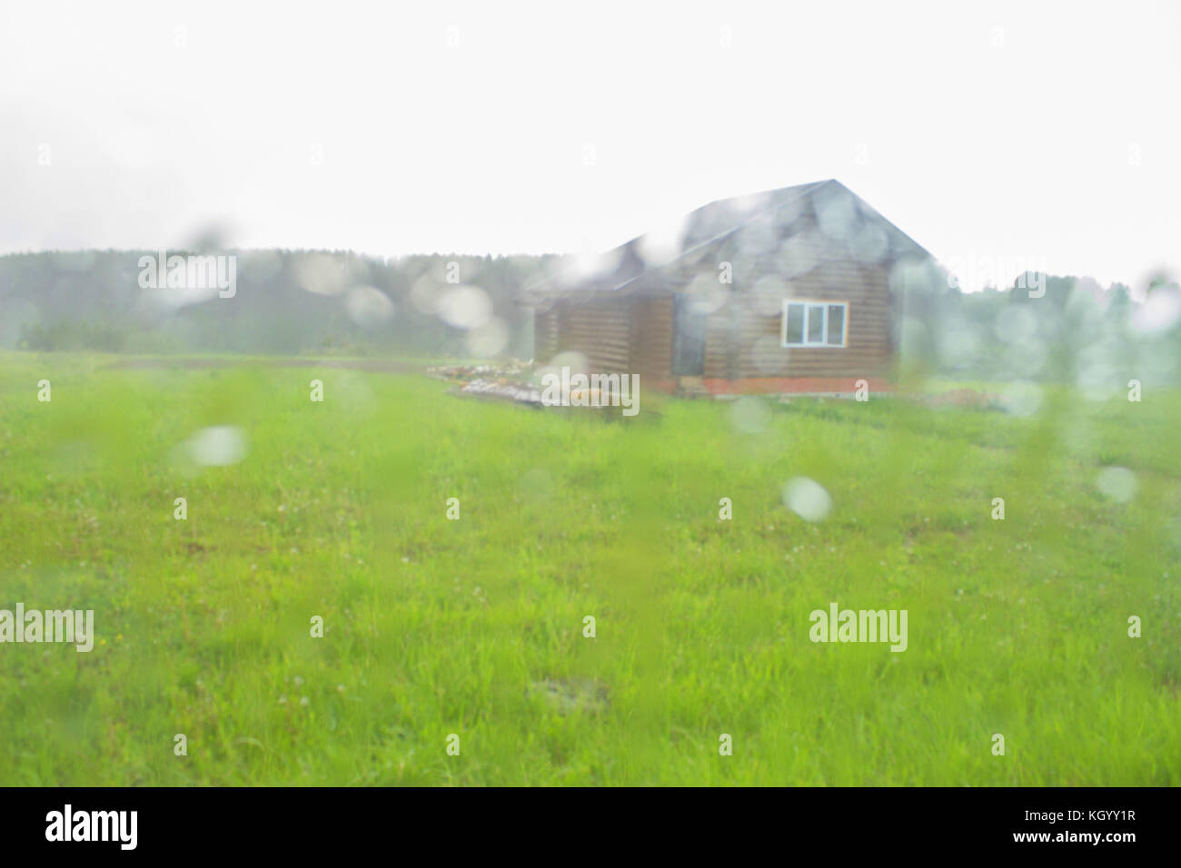 An old house on the prairie. rain. blur Stock Photo - Alamy