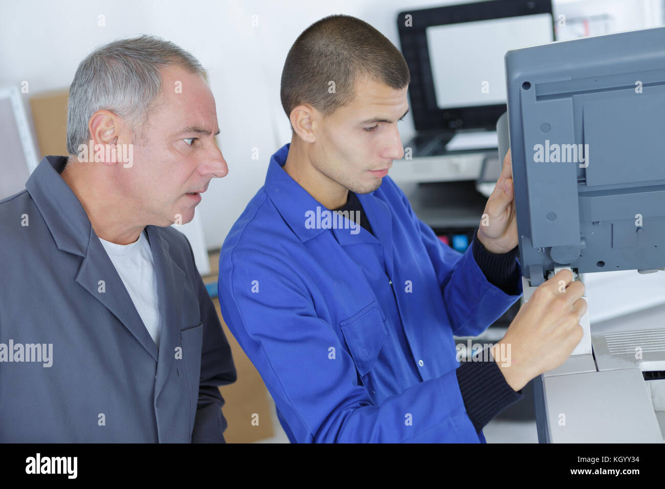 young apprentice with professional Stock Photo - Alamy