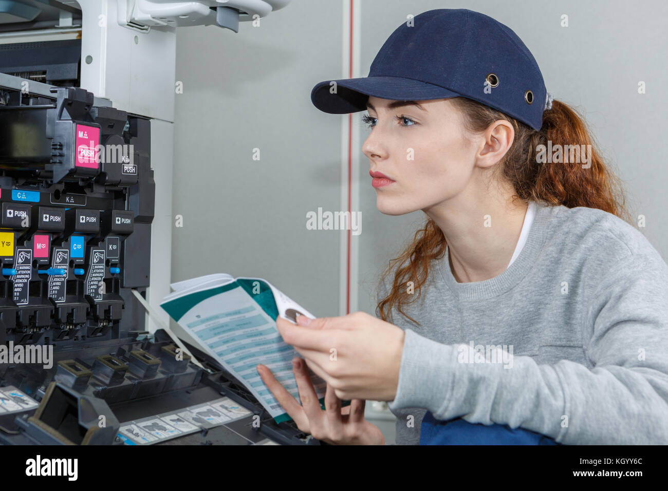 female engineers checking an installation manual Stock Photo - Alamy
