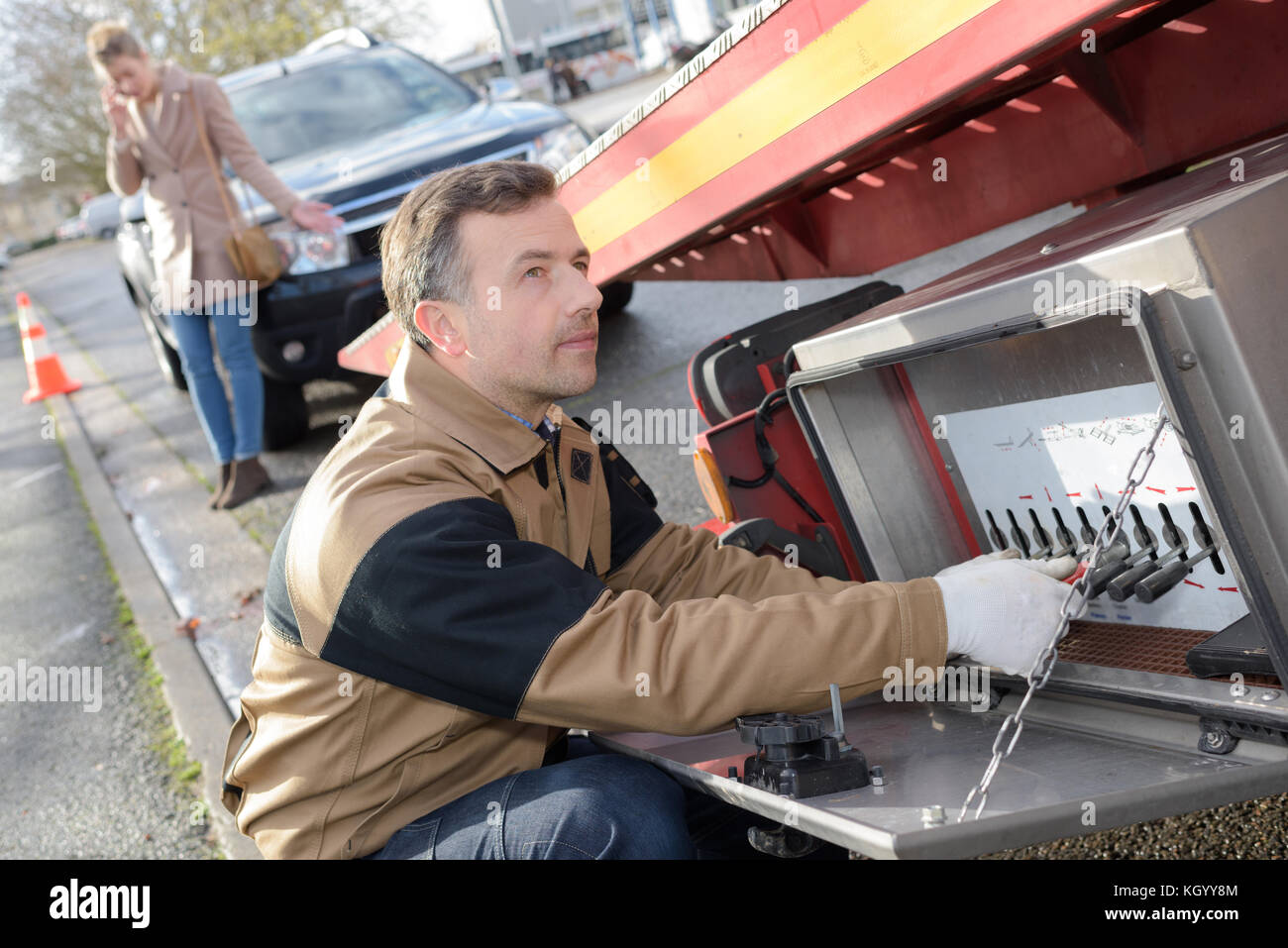 man towing car on his tow truck Stock Photo - Alamy