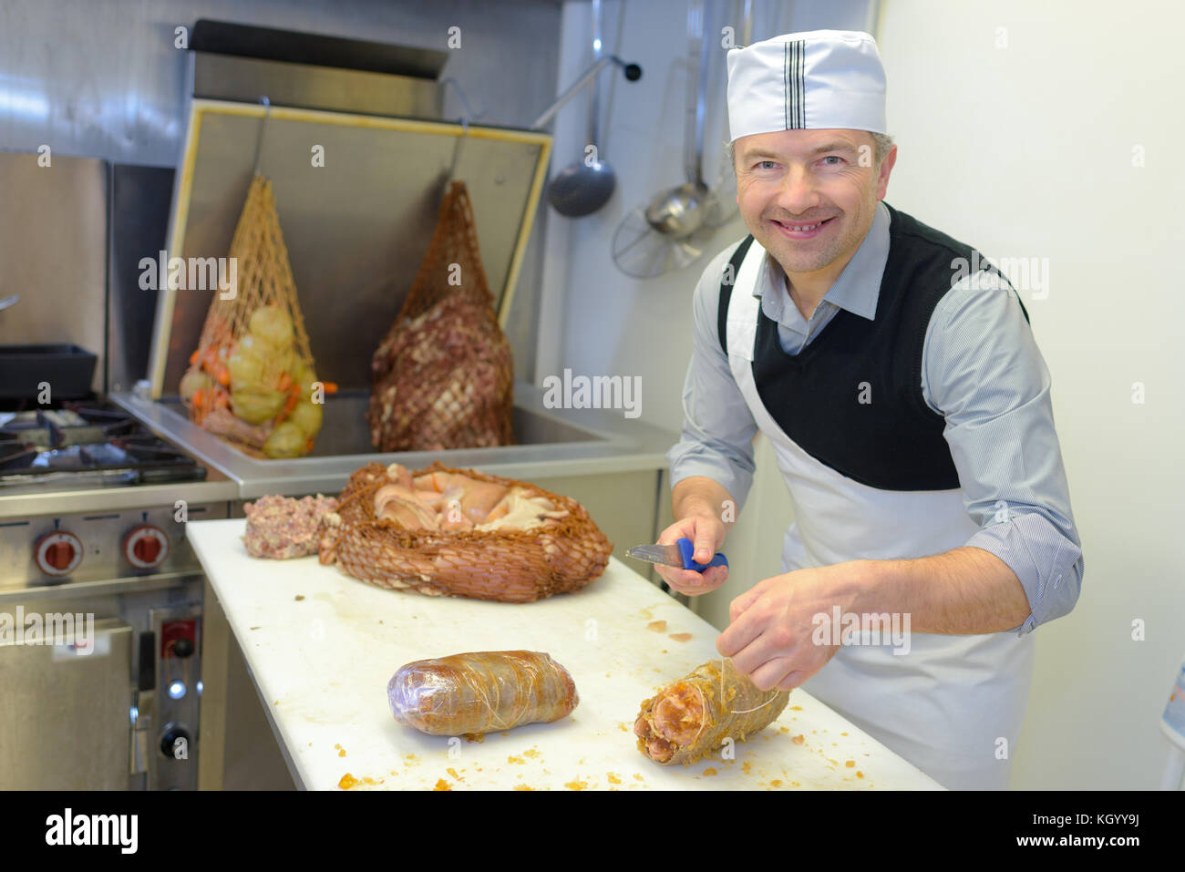 cutting a cooked meat Stock Photo - Alamy
