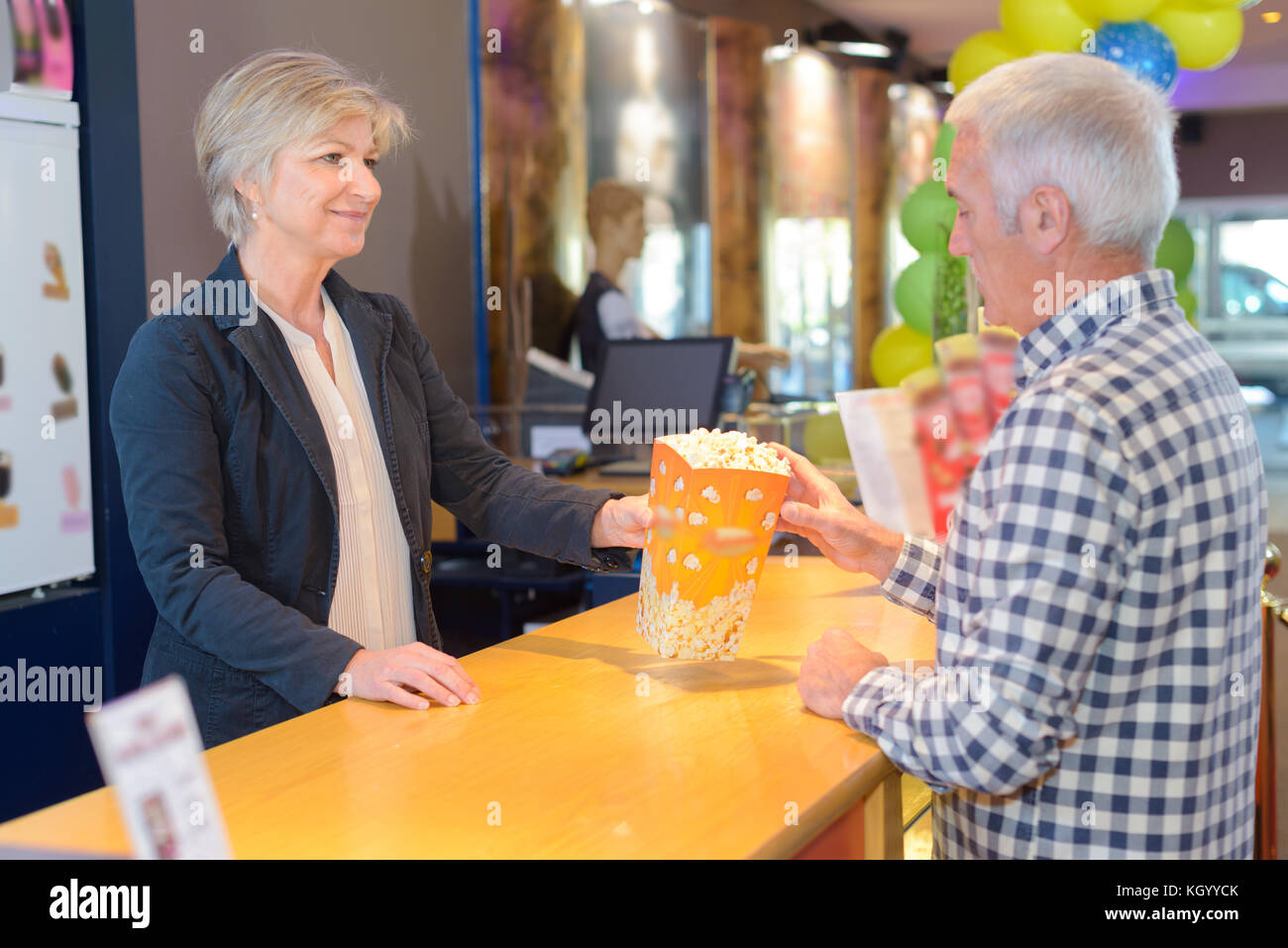 ordering popcorn for the movie Stock Photo - Alamy