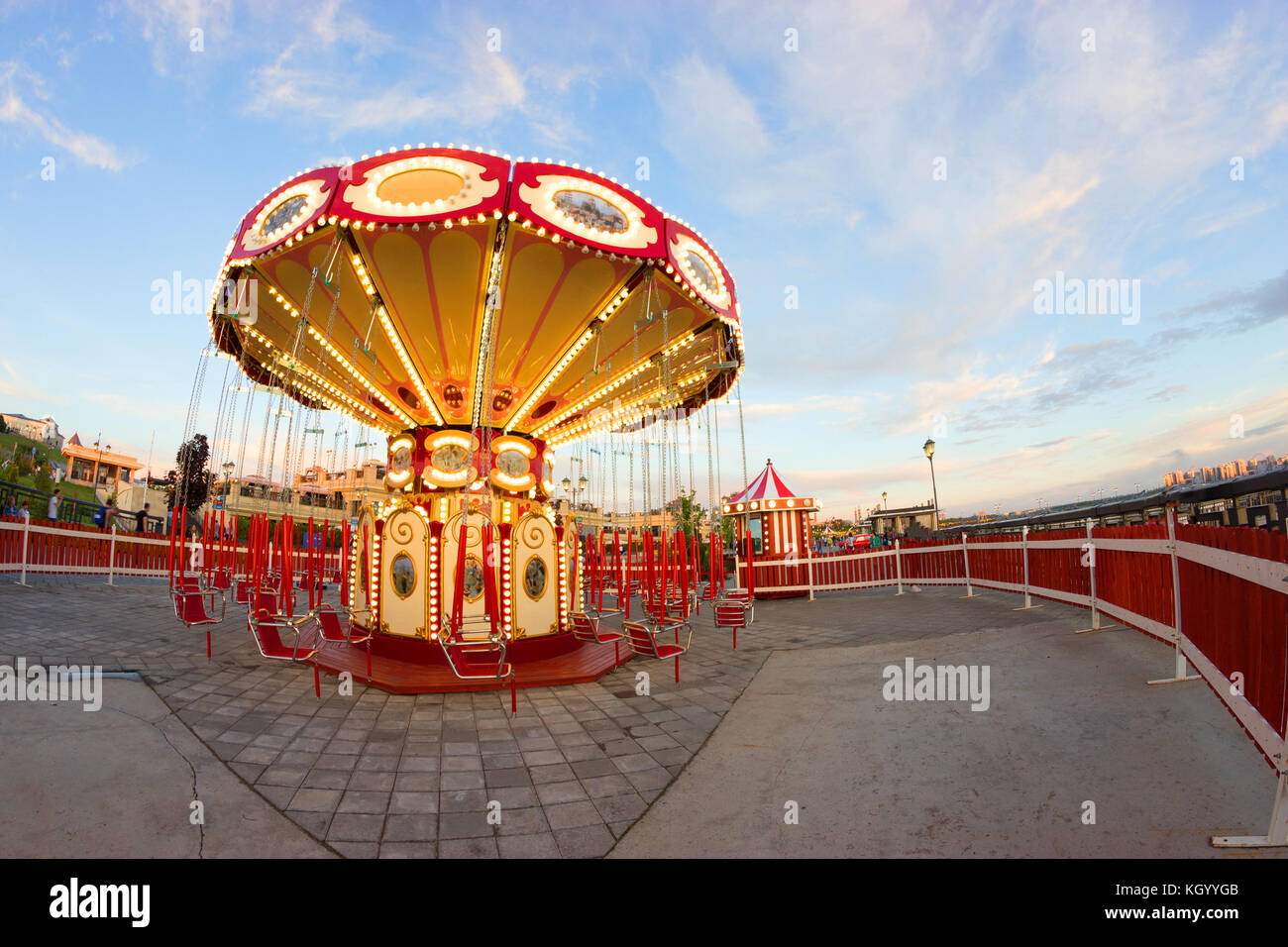red illuminated french carousel in amusement park for childerent Stock ...