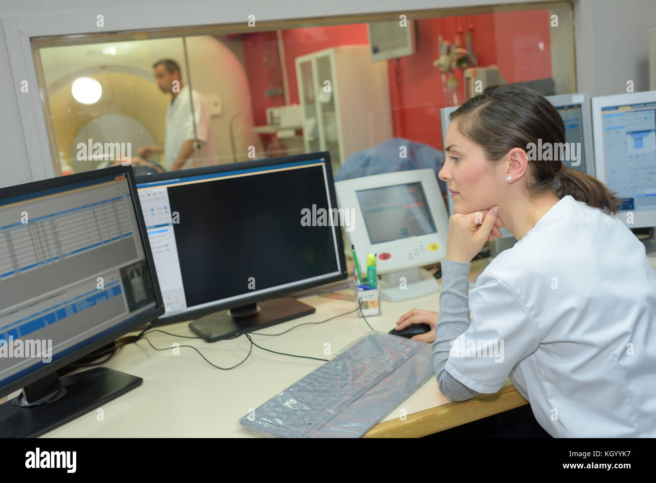 Medic monitoring computer screens Stock Photo - Alamy
