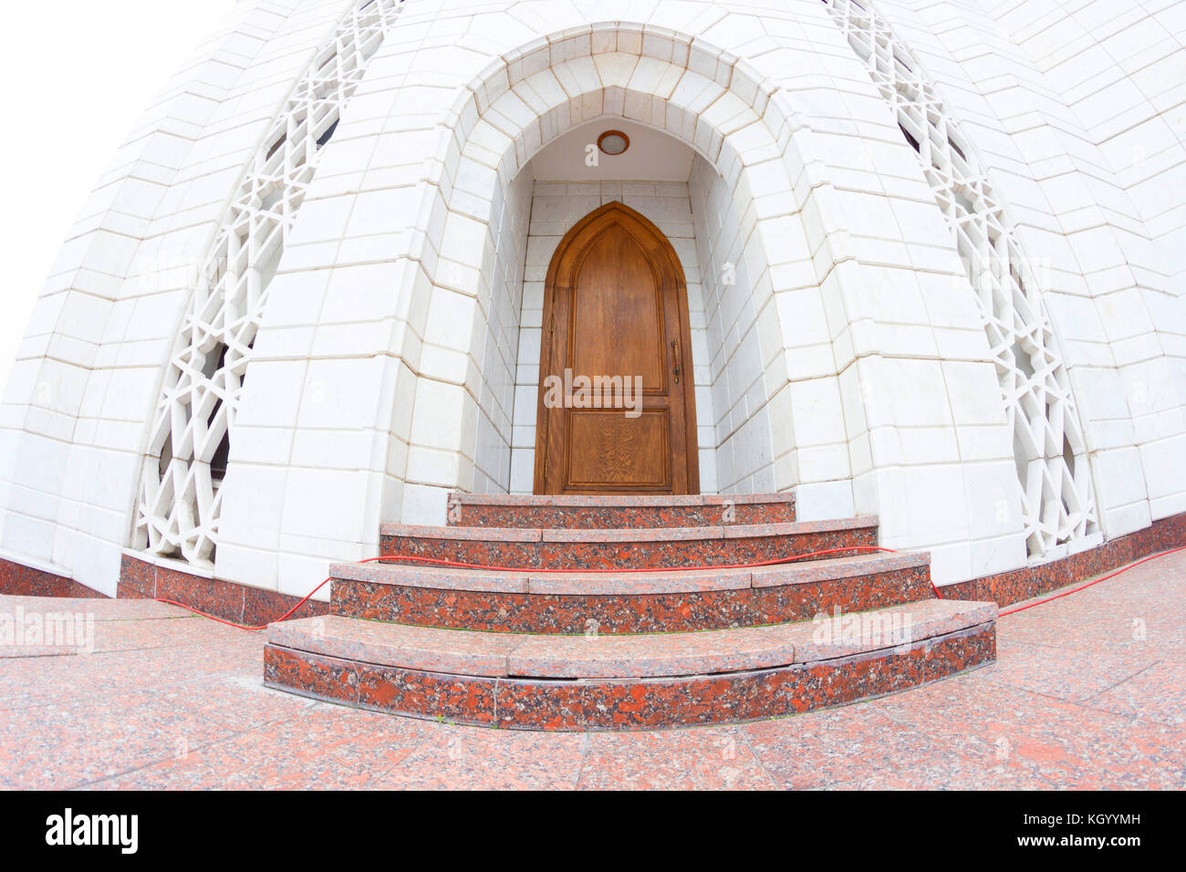 old eastern style door in white building Stock Photo - Alamy