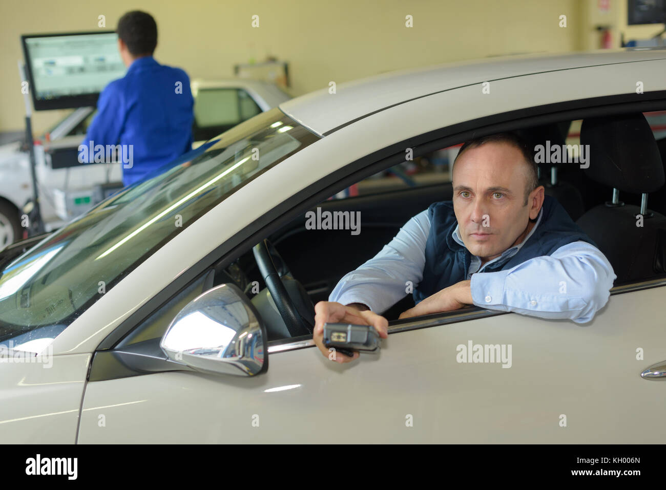 man operating controls in vehicle test station Stock Photo - Alamy