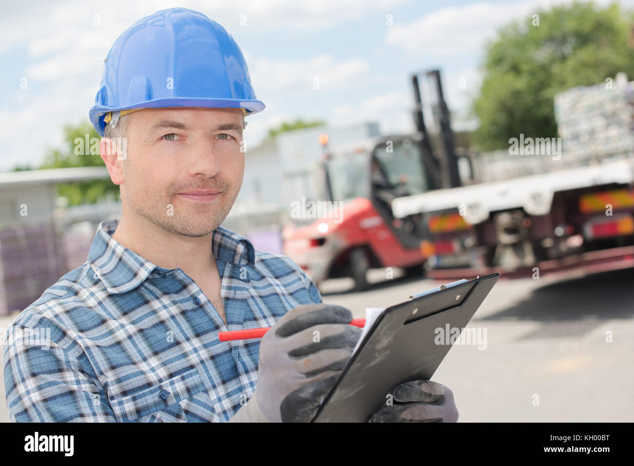Portrait of man with clipboard Stock Photo - Alamy