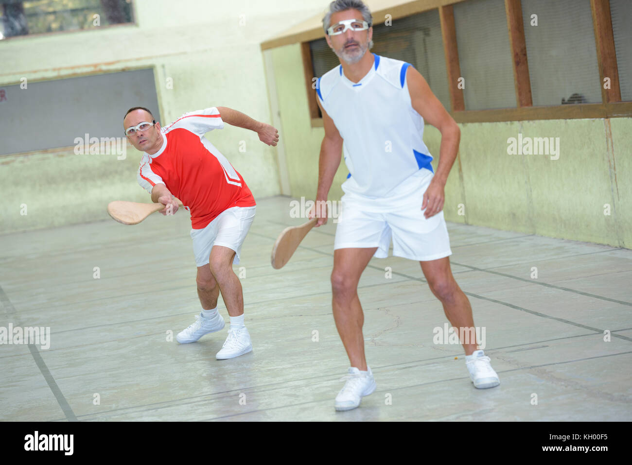Men playing a racket sport Stock Photo - Alamy