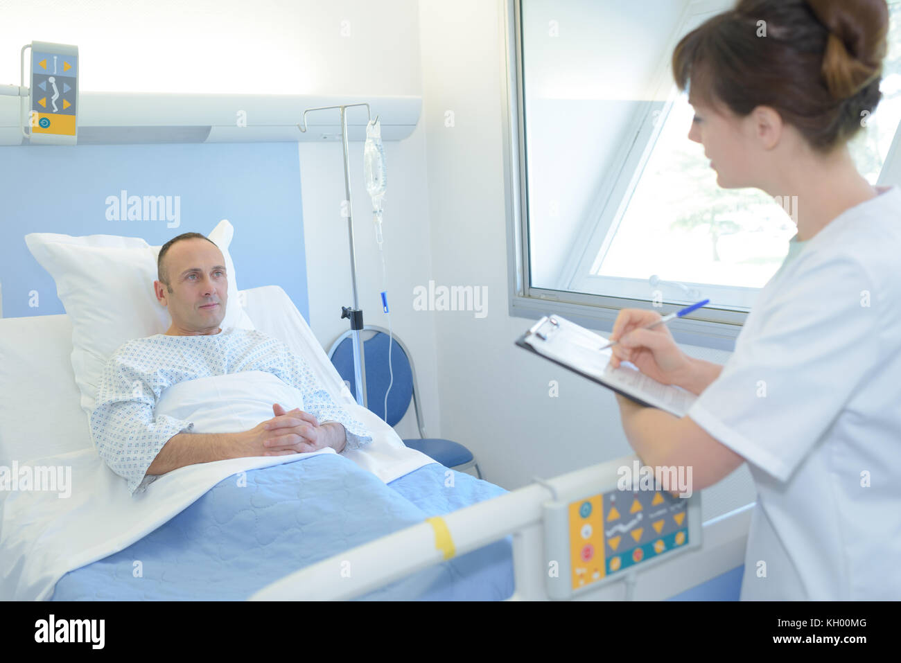 asking the patient how he is feeling Stock Photo - Alamy